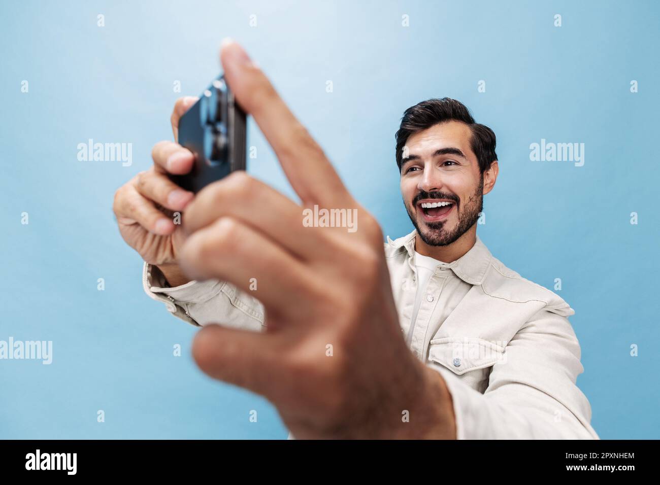 Portrait of a stylish man brunette smile and open mouth looks at the ...