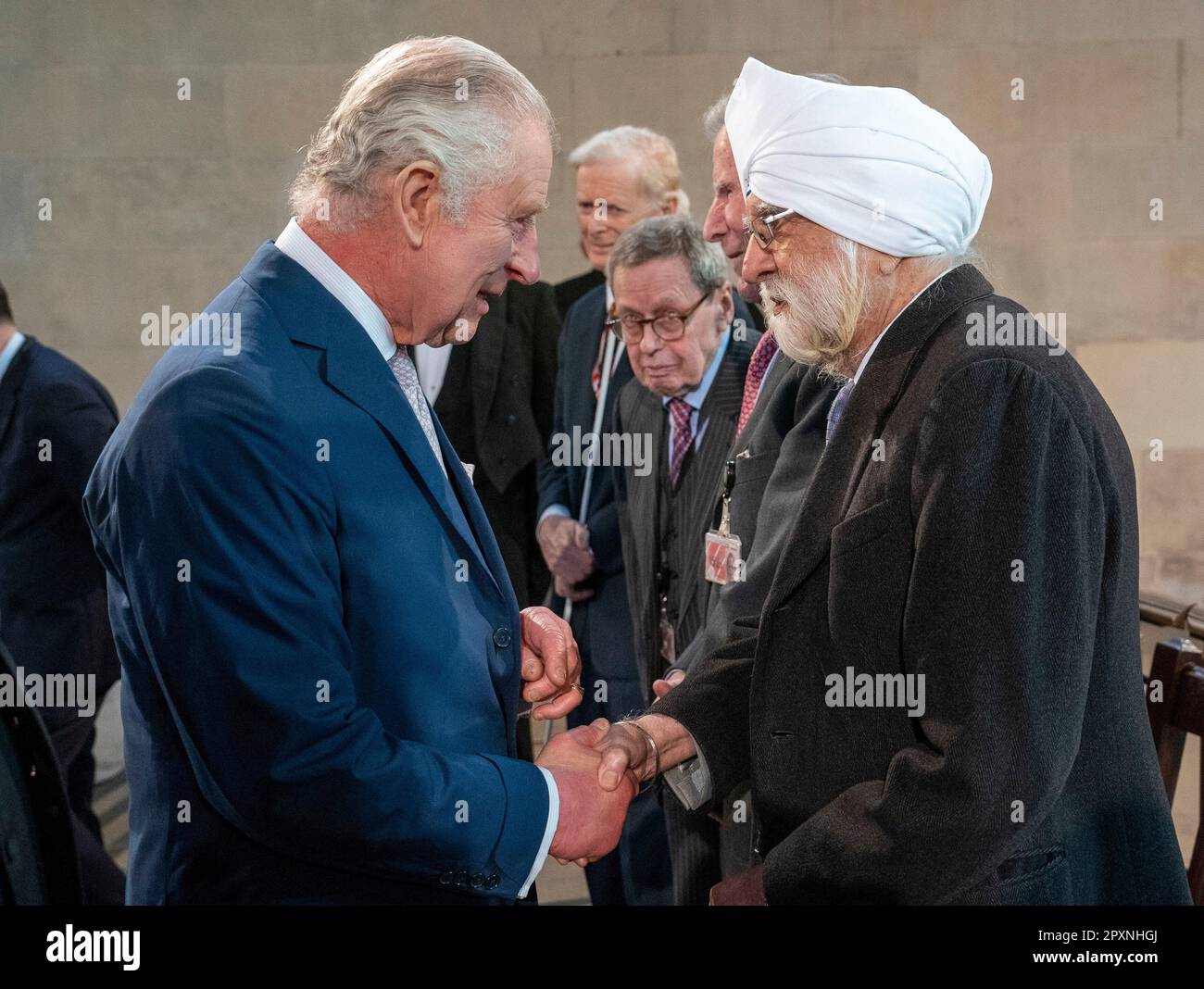 Britain's King Charles III speaks with Lord Suri of Ealing during his ...