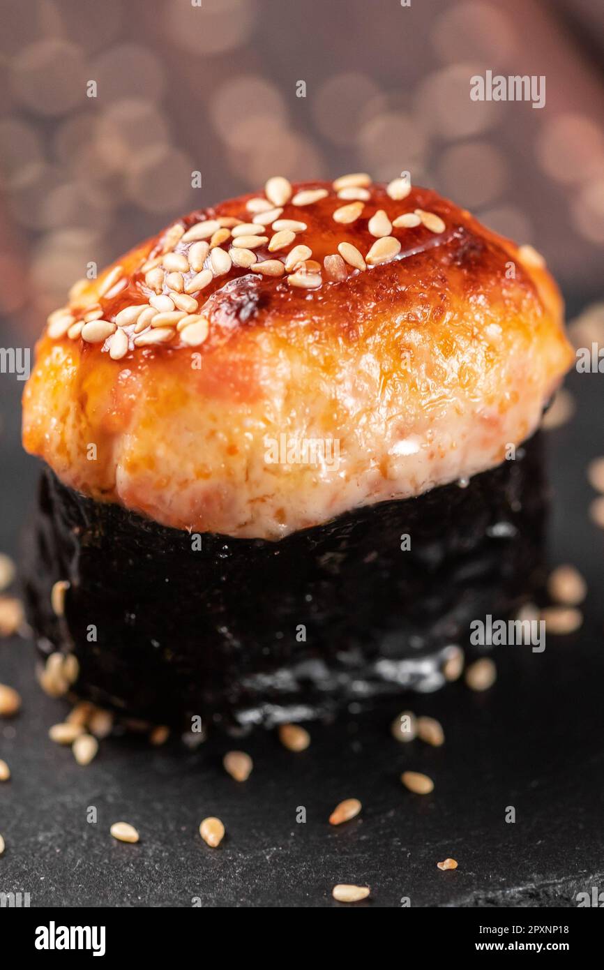 Baked shrimp gunkan on wooden background. Simple gunkan sushi with ...