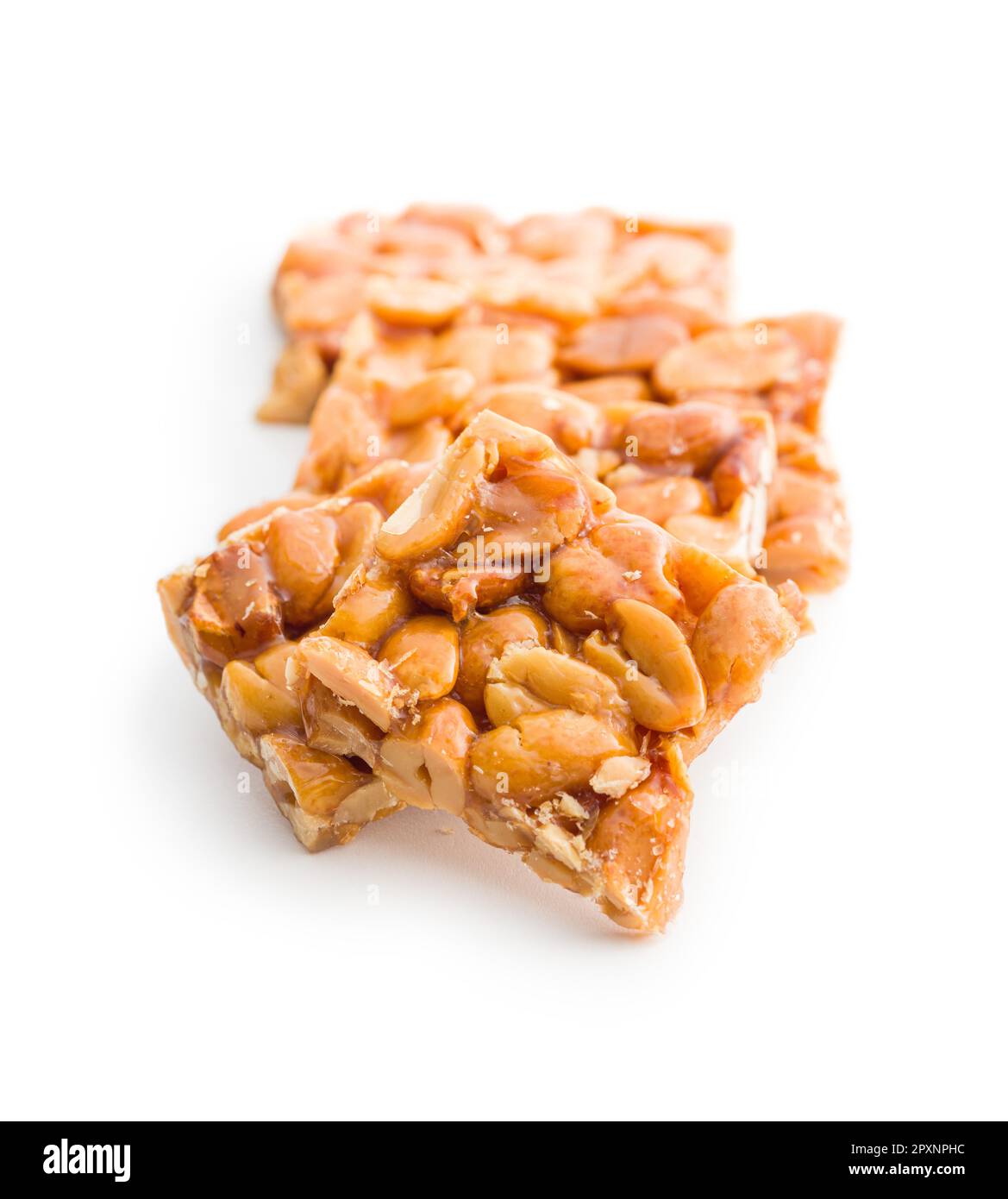 Sweet peanut brittle. Tasty peanuts in caramel isolated on the white ...