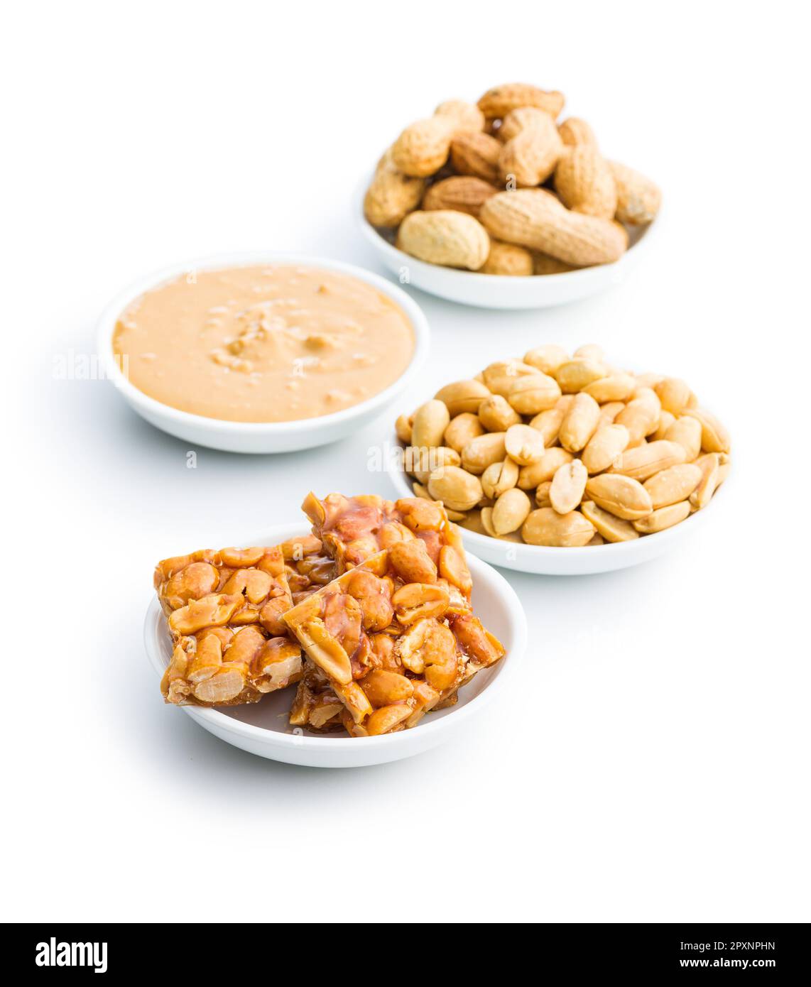 Sweet peanut brittle, peanuts and peanuts butter isolated on the white ...