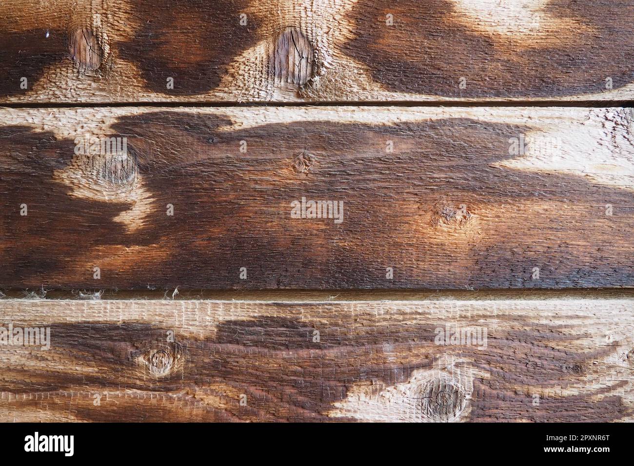 Burnt scorched horizontal boards background. Wooden background close-up ...
