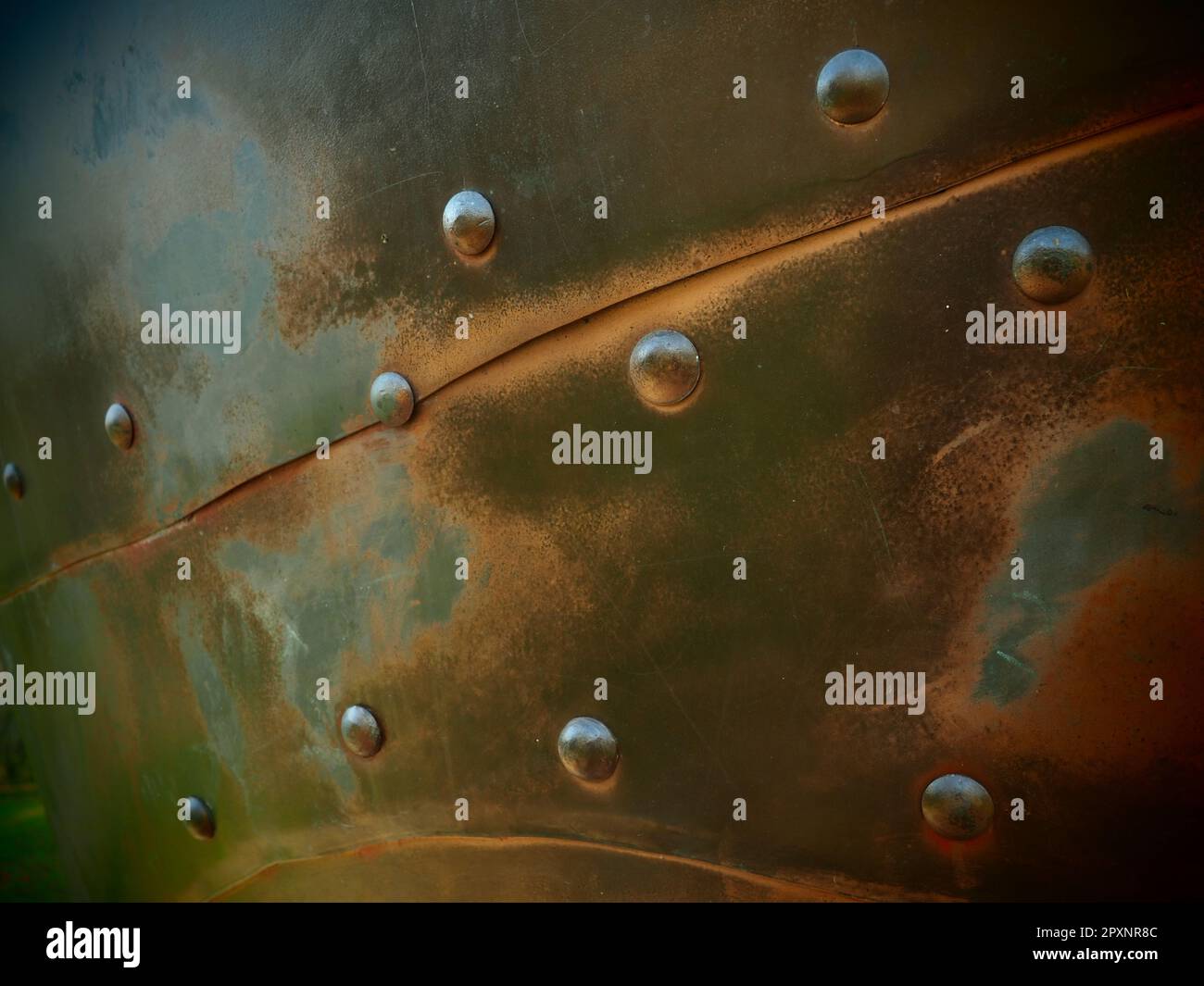 Metal surface with rivets and bolts. Abstract background of a military ...