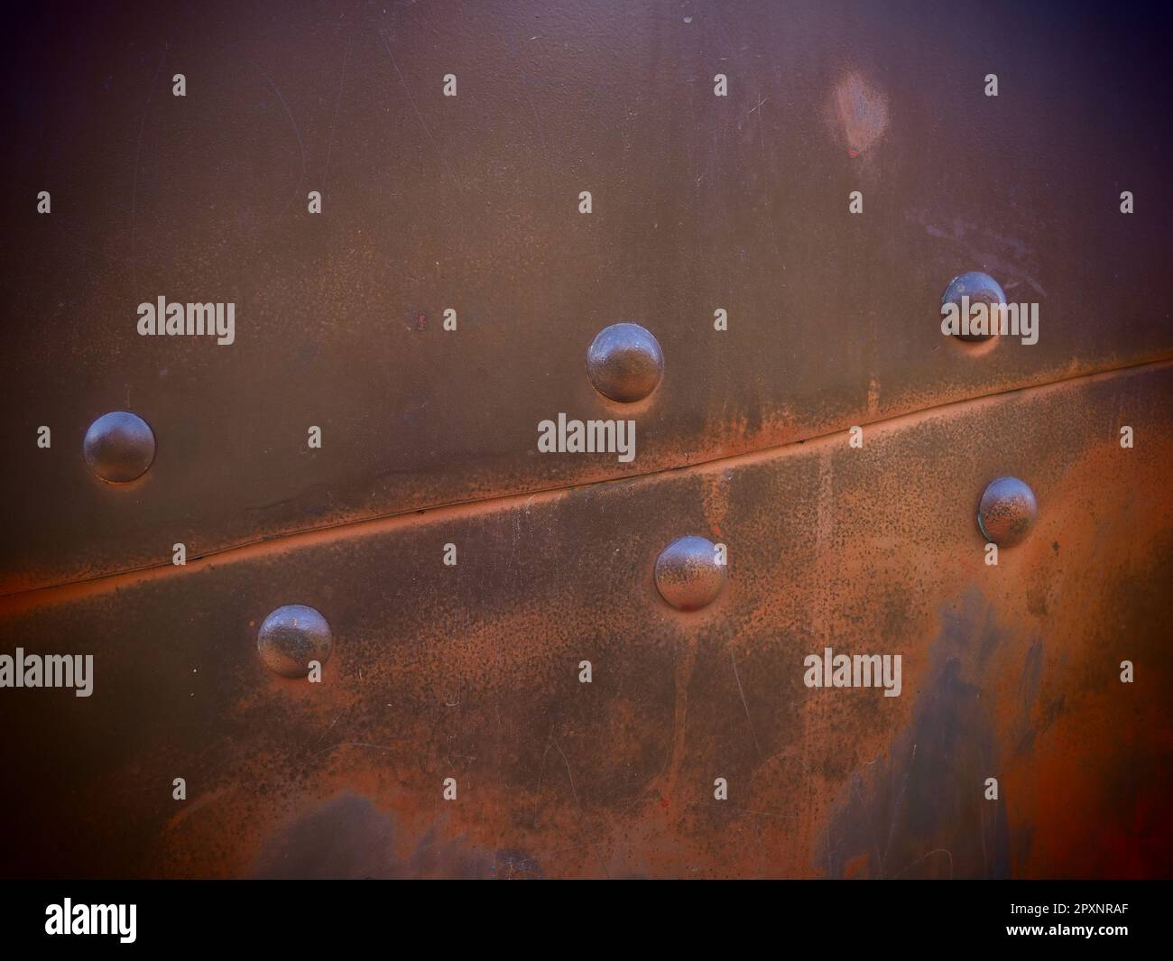 Metal surface with rivets and bolts. Abstract background of a military ...