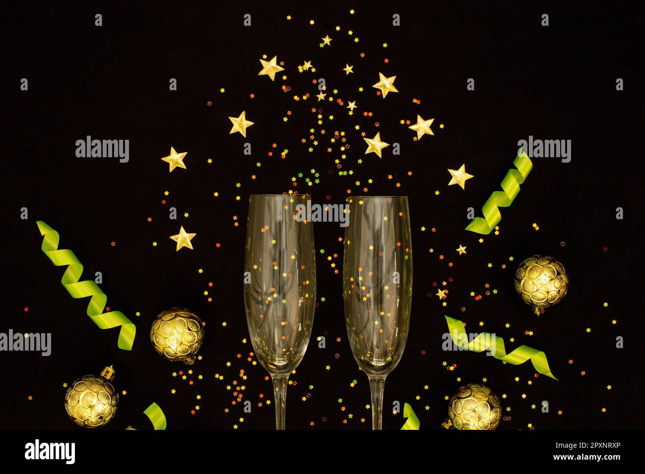 Champagne with party concept, Champagne glass with ribbon and gold ball ...