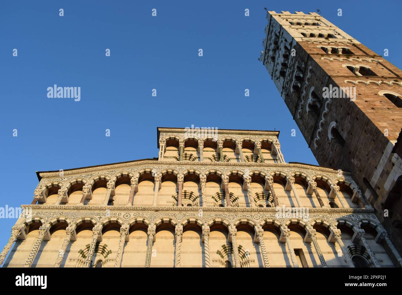 An elegant clock tower with a built-in clock face, standing proudly in ...