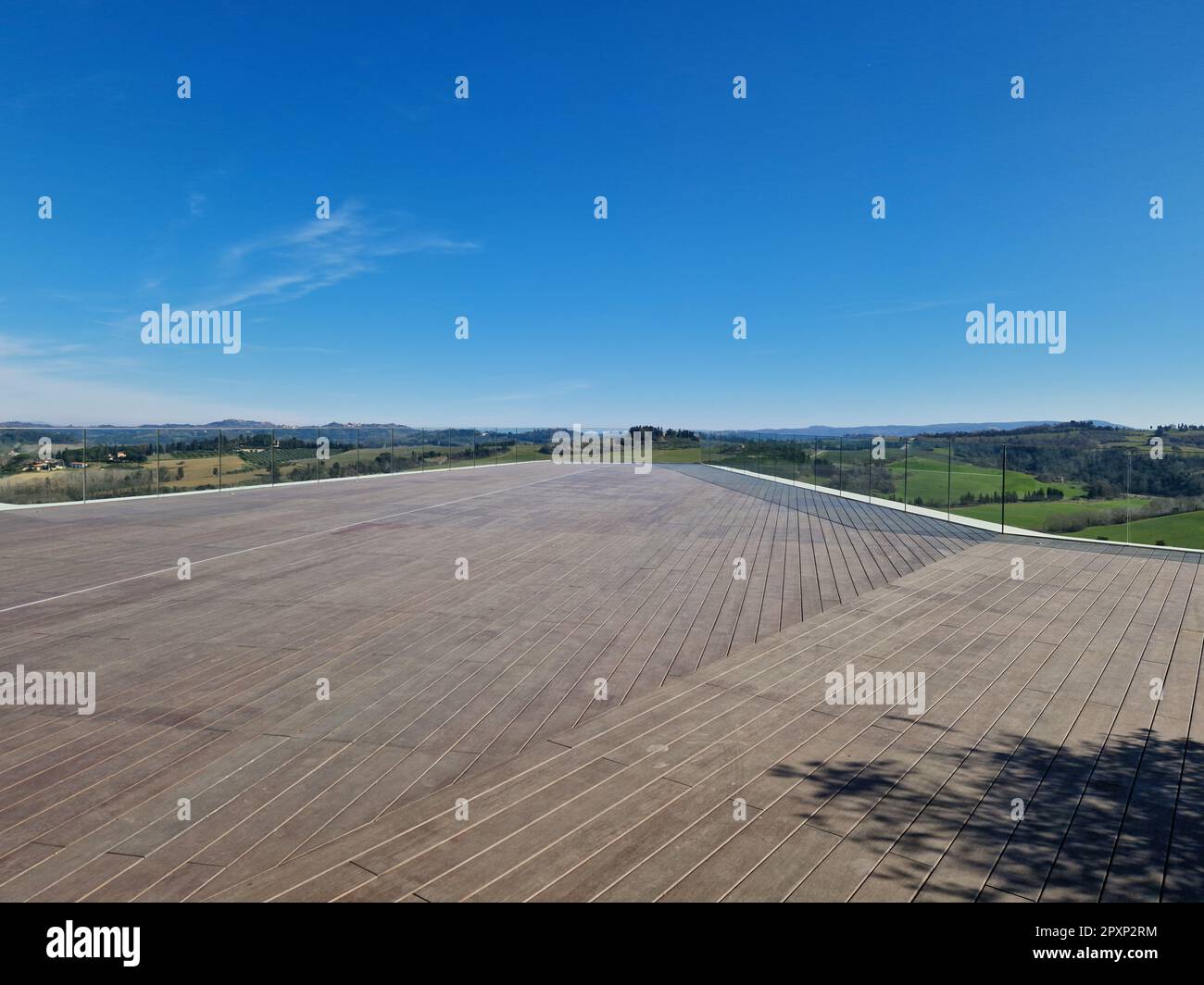 A wooden platform constructed atop a grassy hill Stock Photo - Alamy