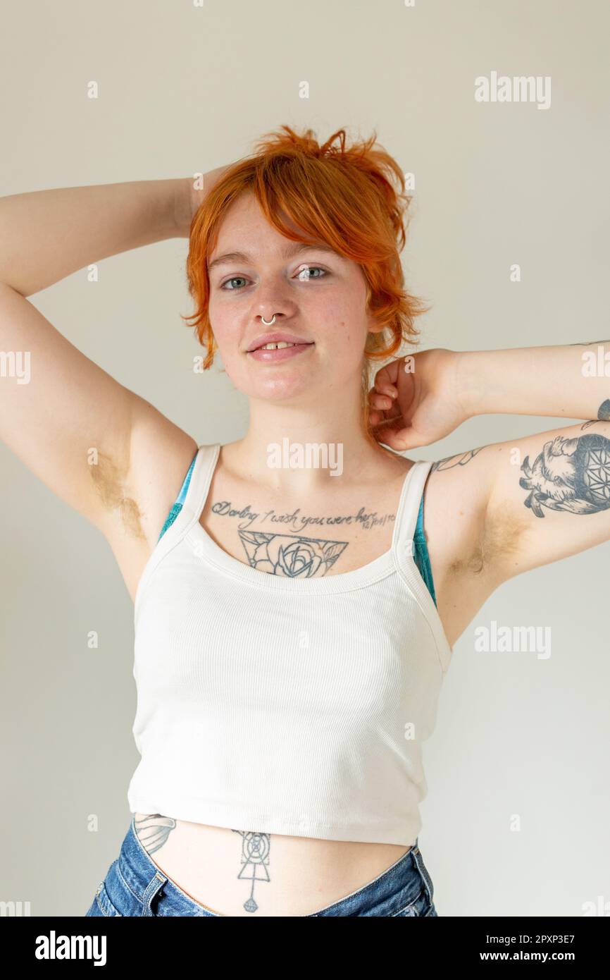 A Beautiful Woman In Her Mid Twenties With Tattoos And Unshaved Armpits