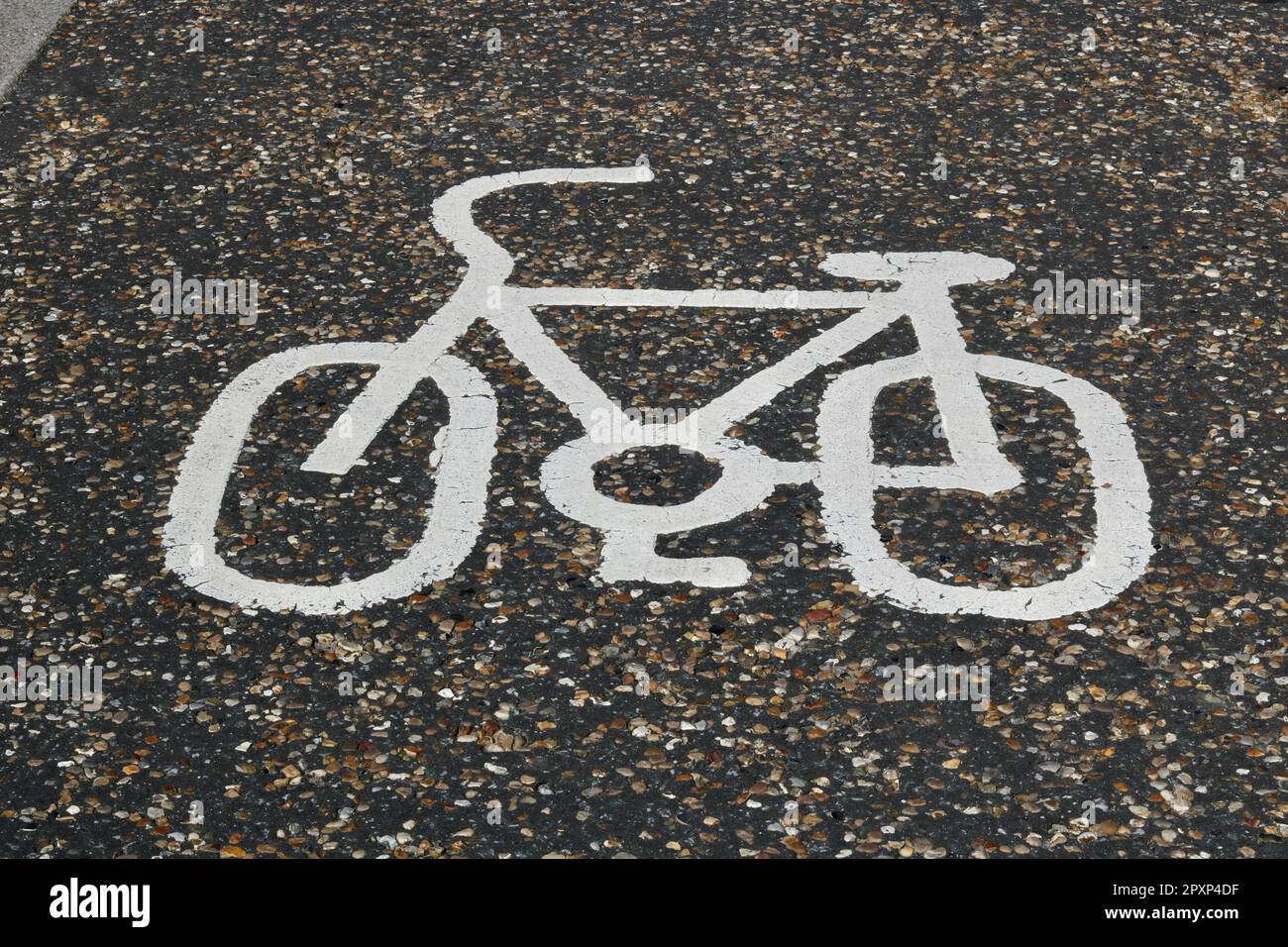 Large white bicycle sign painted on tarmac road with copy space Stock ...