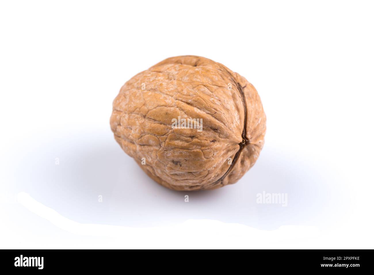 Dried walnut isolated on a white background Stock Photo - Alamy