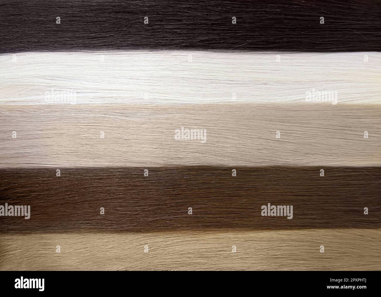 Strands of natural hair of different colors for extensions. Hair color ...