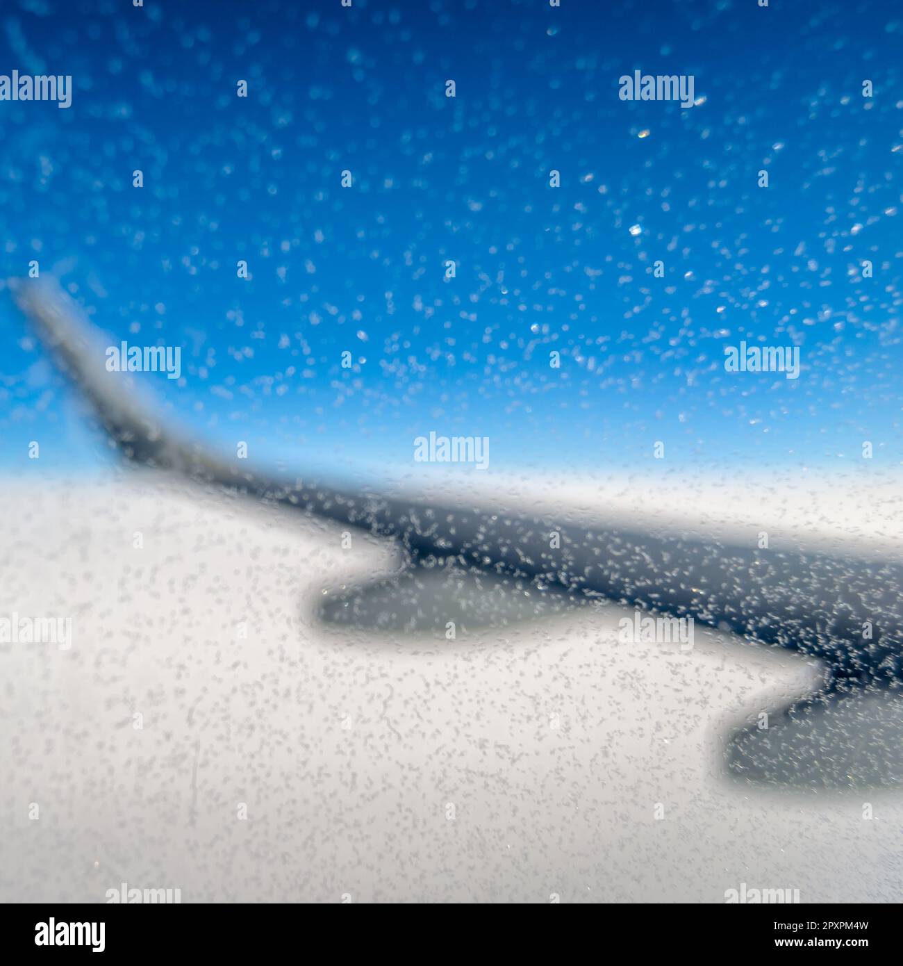 Ice crystals on the window of an airplane in flight Stock Photo - Alamy
