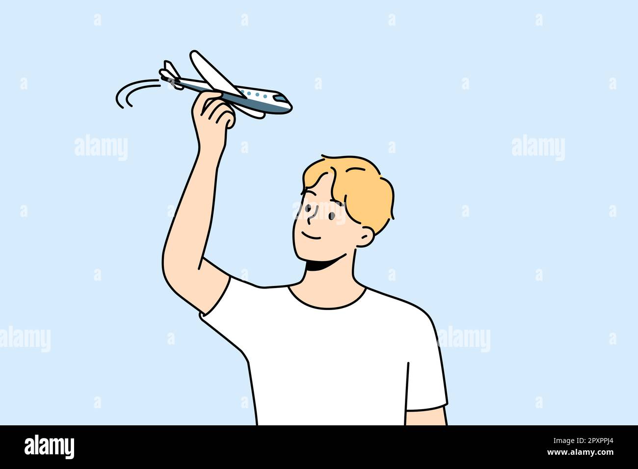 Young man have fun playing with airplane model. Smiling guy flying with ...