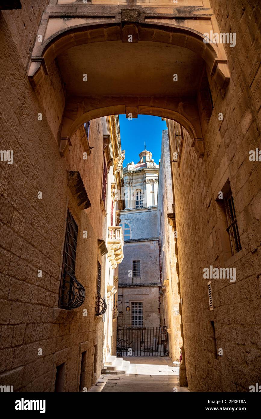 A view of old Mdina street with a traditional Maltese style openwork ...