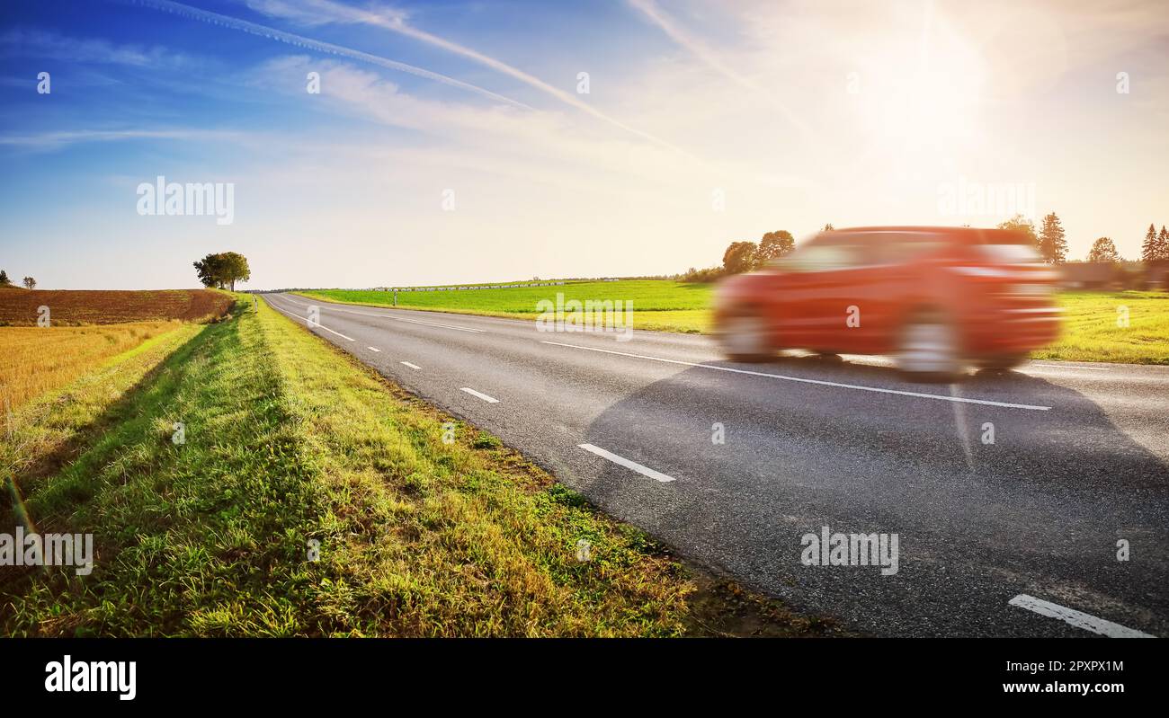 Car moving on the coutry road in sunset. Background of the rural scene ...