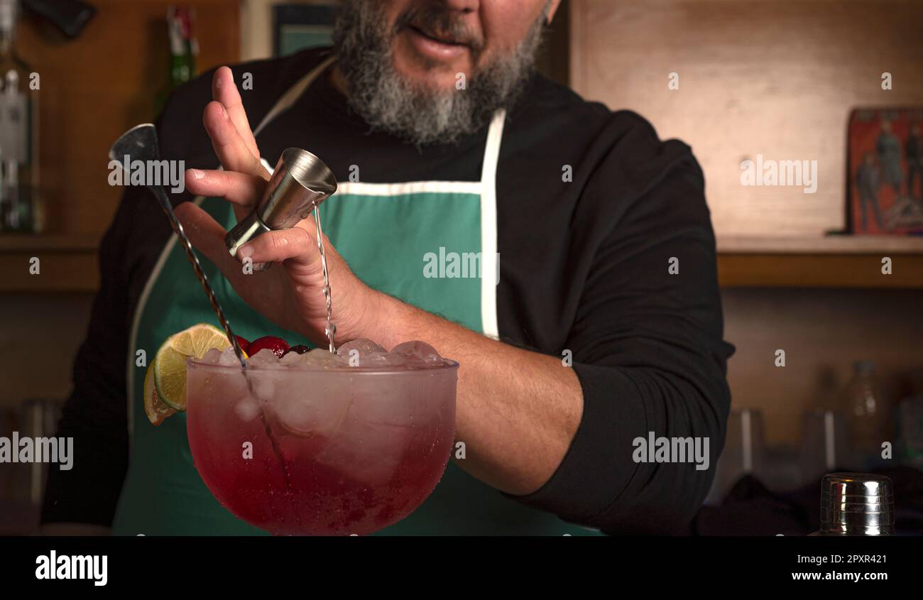Barman making alcohol cocktail close hi-res stock photography and ...