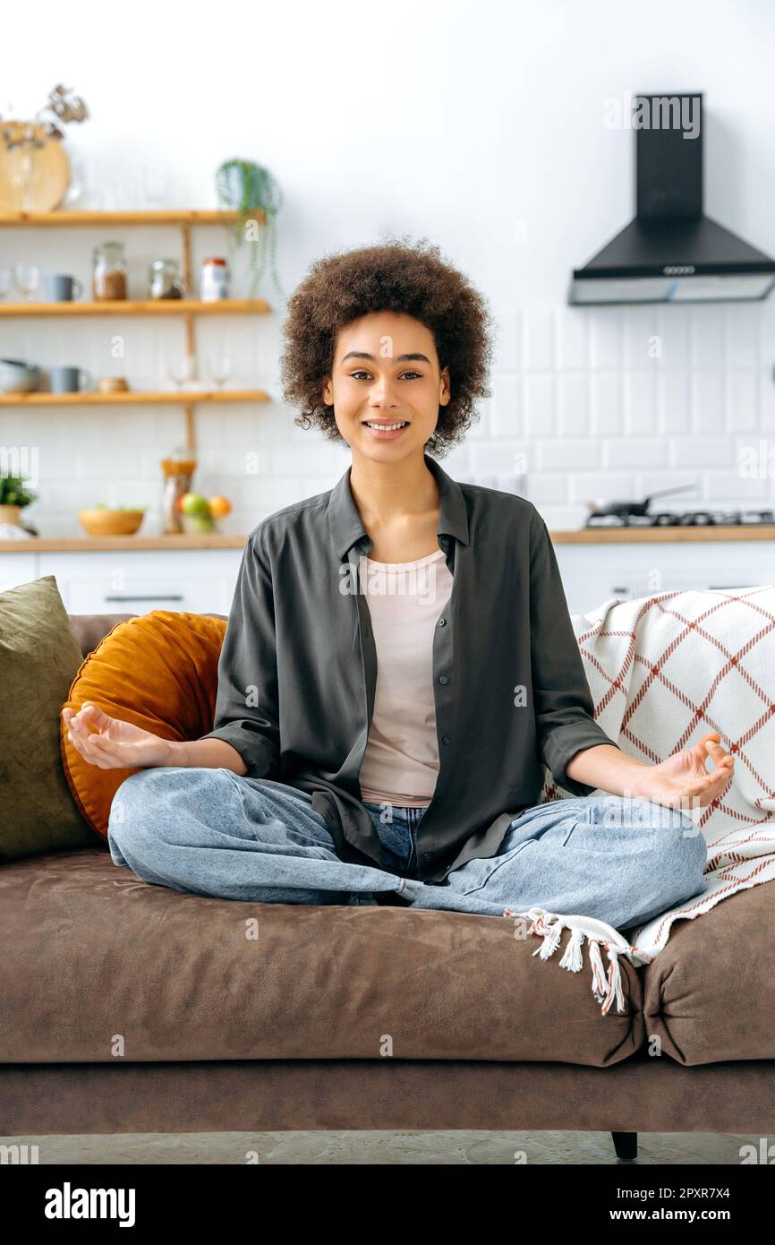 Vertical photo of calm happy peaceful relaxed african american young ...