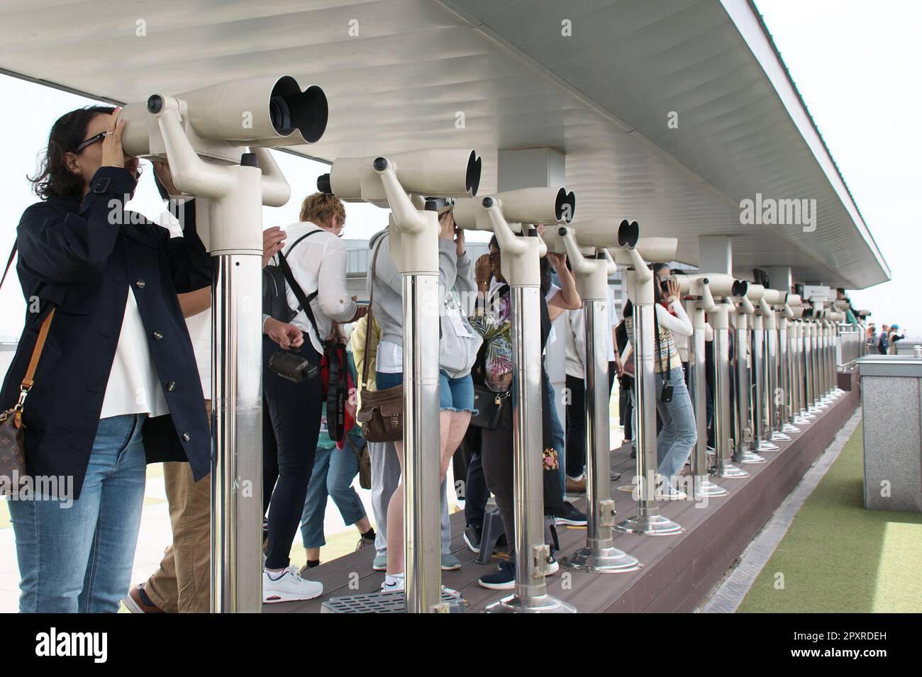 Paju, South Korea. 02nd May, 2023. A tourist use binoculars to see ...