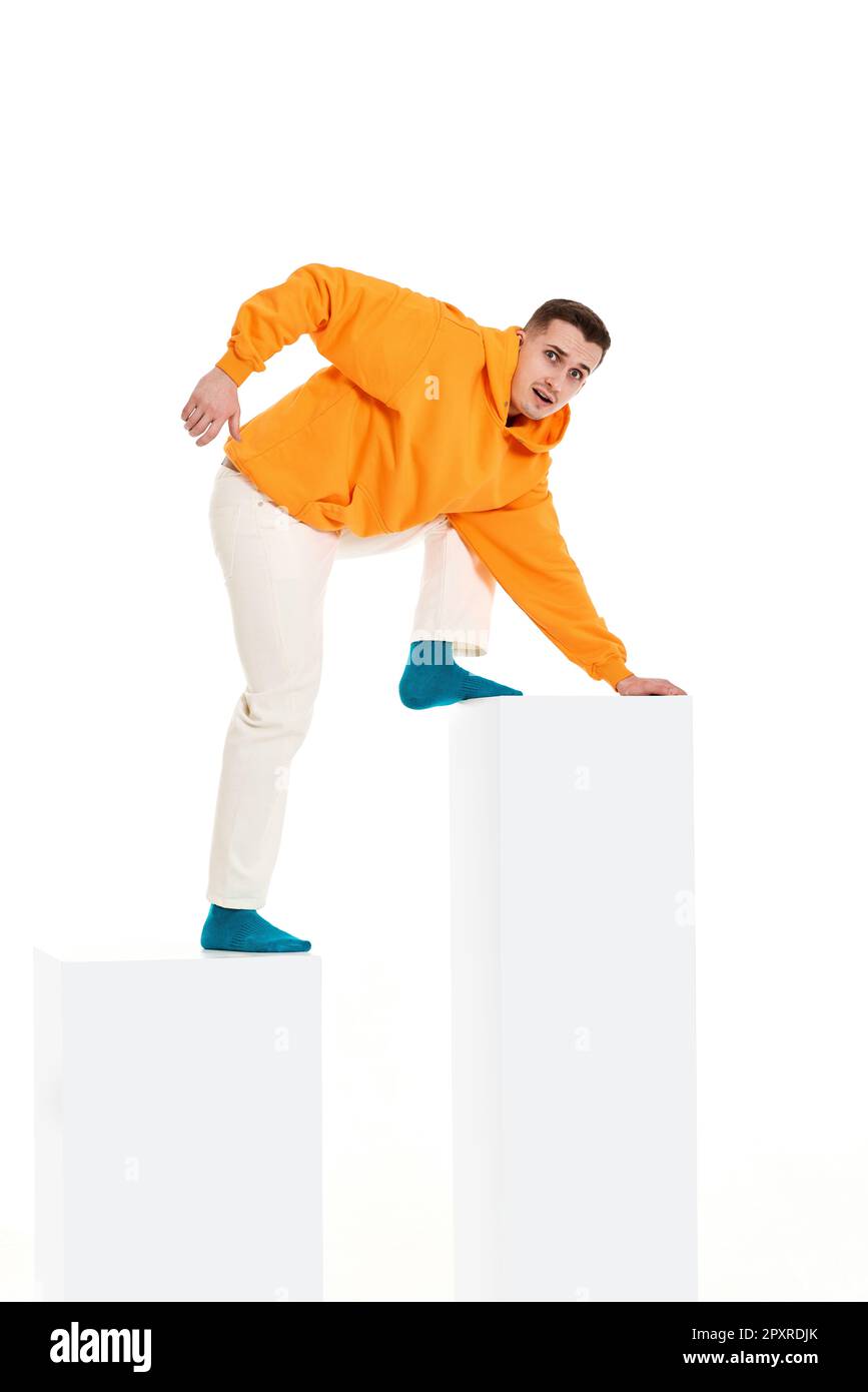 man rising up the career ladder. guy following up on white diagram ...