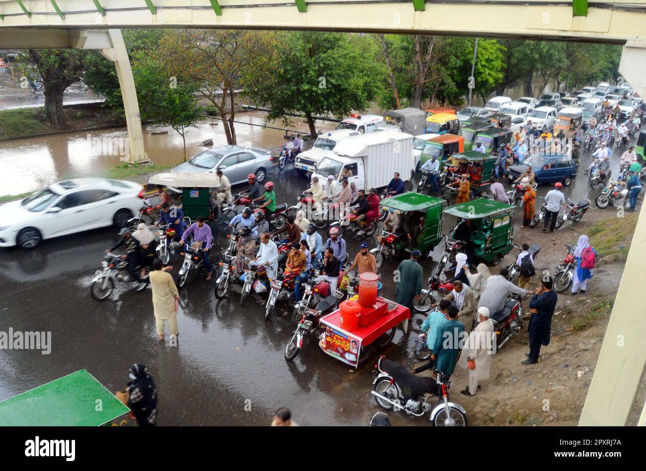 A large numbers of vehicles stuck in traffic jam during heavy downpour ...
