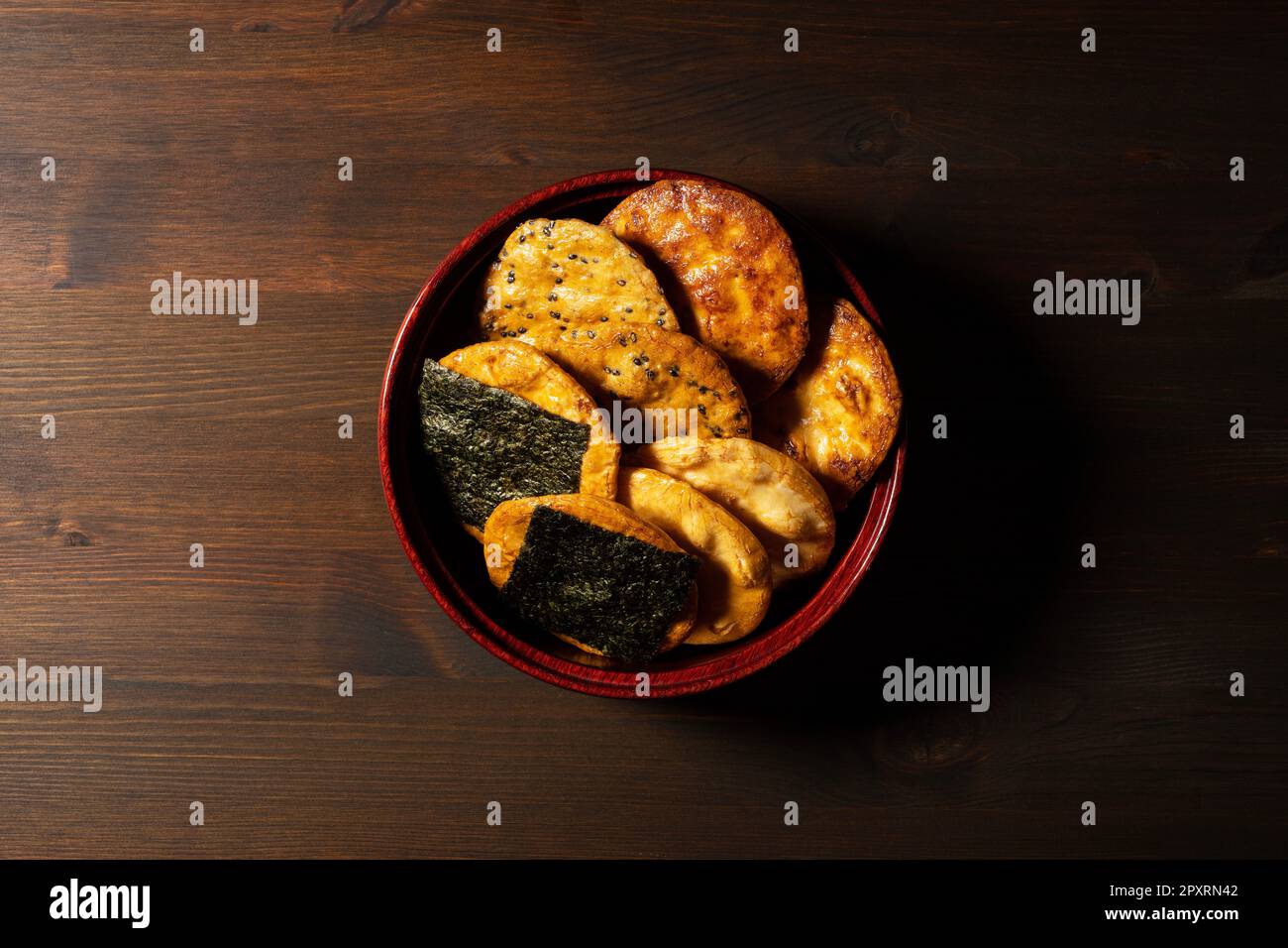 Sembei on the table. Sembei is a Japanese snack. A picture of Japanese ...