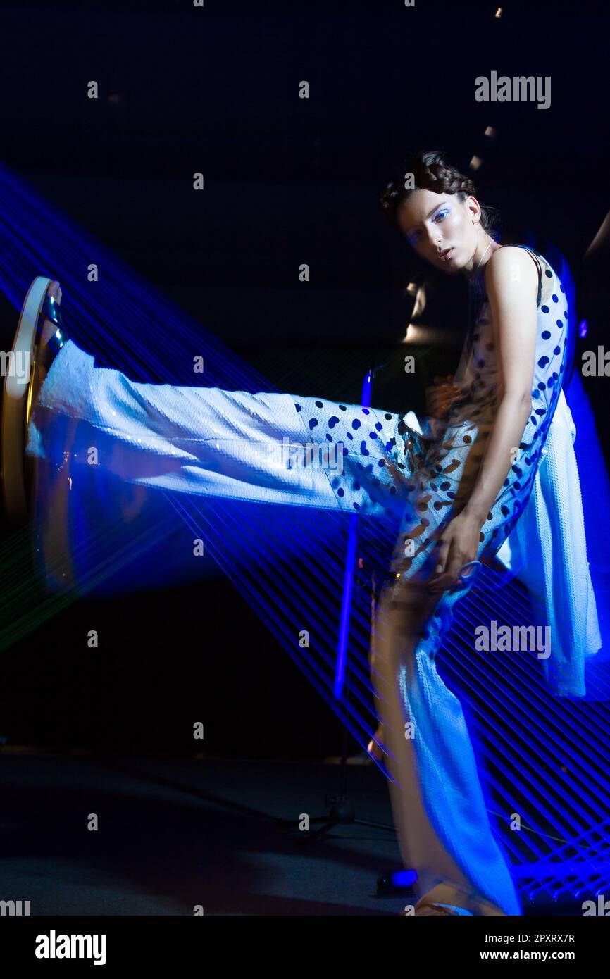 Fashion model beautiful girl in fashionable clothes in ultraviolet ...