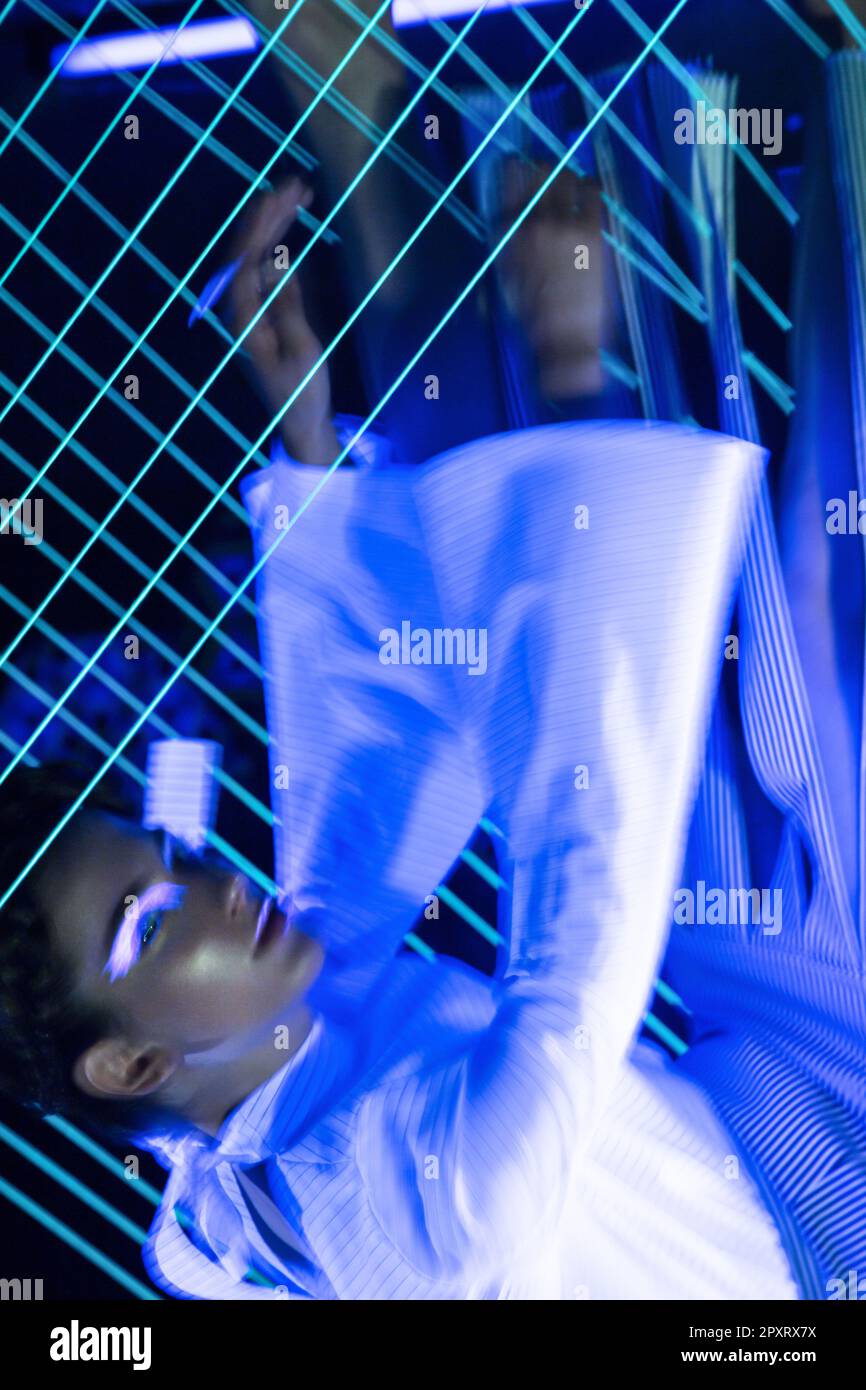 Fashion model beautiful girl in fashionable clothes in ultraviolet ...