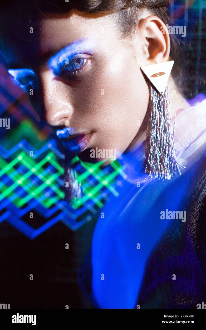 Fashion model beautiful girl in fashionable clothes in ultraviolet ...