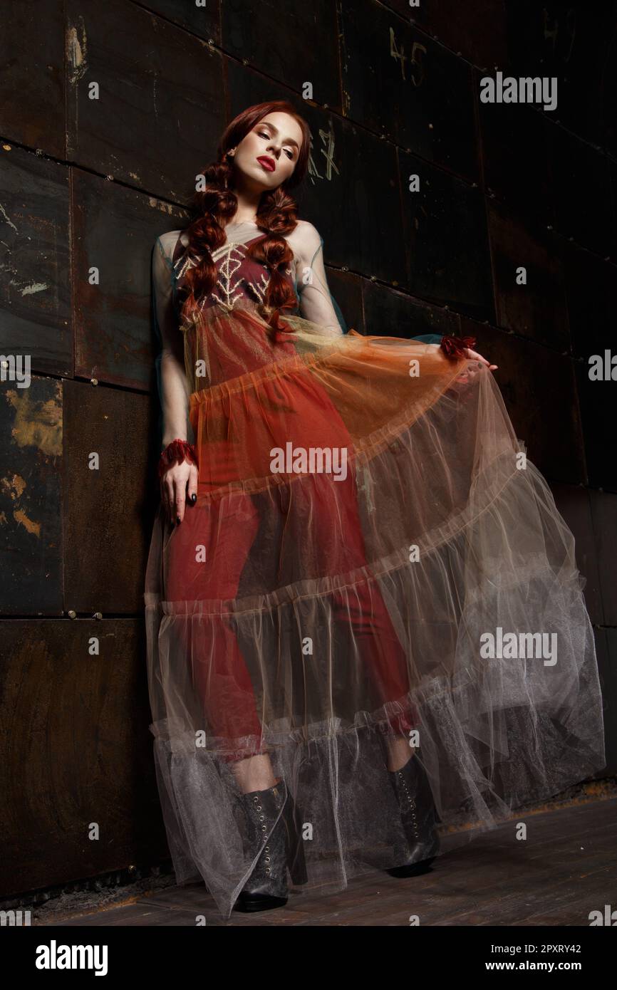 Beautiful girl in designer fashionable transparent clothes posing in ...