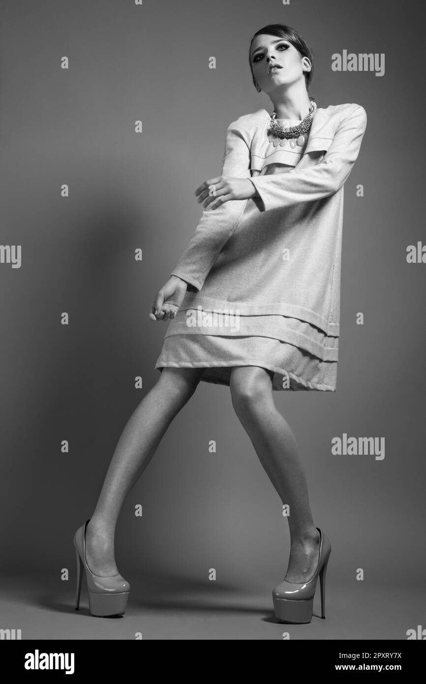 Beautiful fashionable girls in a stylish dress, showing different poses ...
