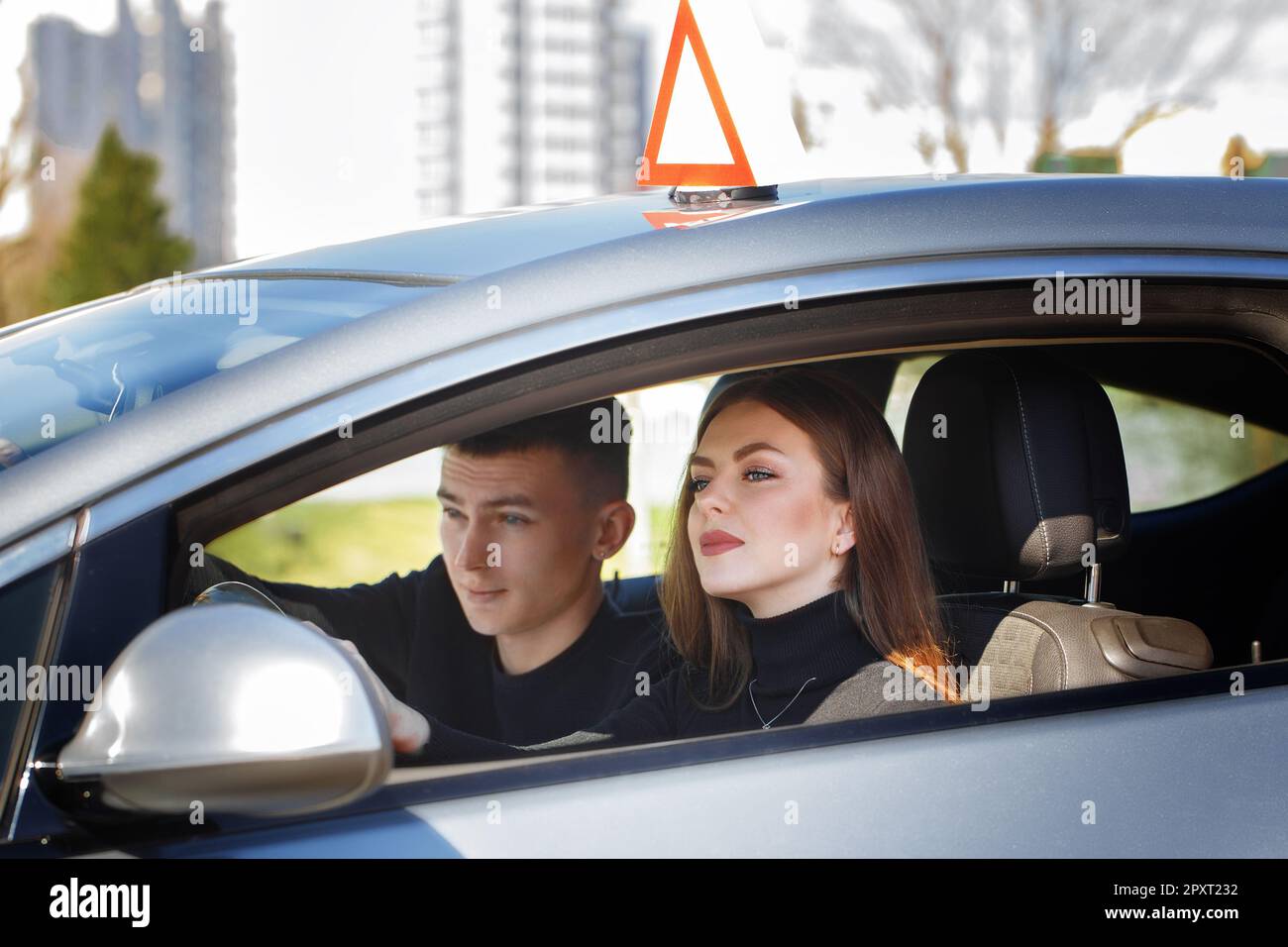 The driver is an auto school instructor and a female student on an ...