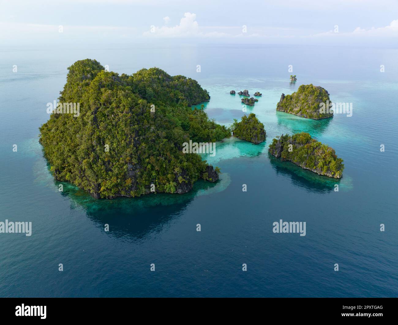 Biodiverse coral reefs surround the dramatic limestone islands that ...
