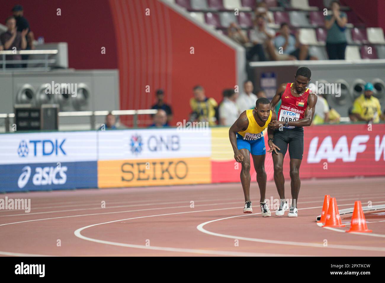 Braima SUNCAR DABO r. (Guinea-Bissau) helps Jonathan BUSBY (Aruba ...