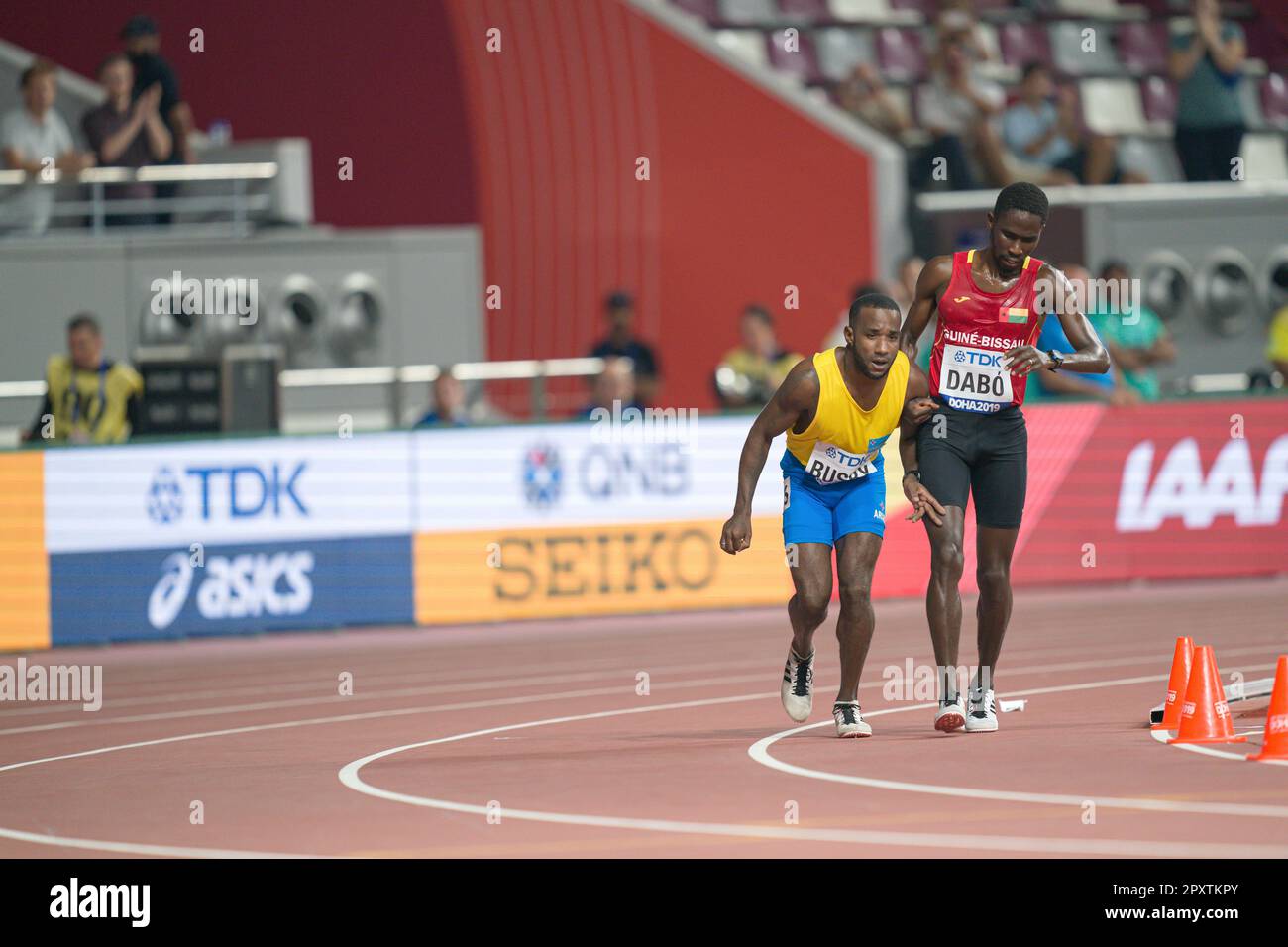 Braima SUNCAR DABO r. (Guinea-Bissau) helps Jonathan BUSBY (Aruba ...