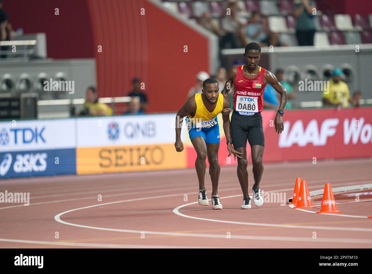 Braima SUNCAR DABO r. (Guinea-Bissau) helps Jonathan BUSBY (Aruba ...