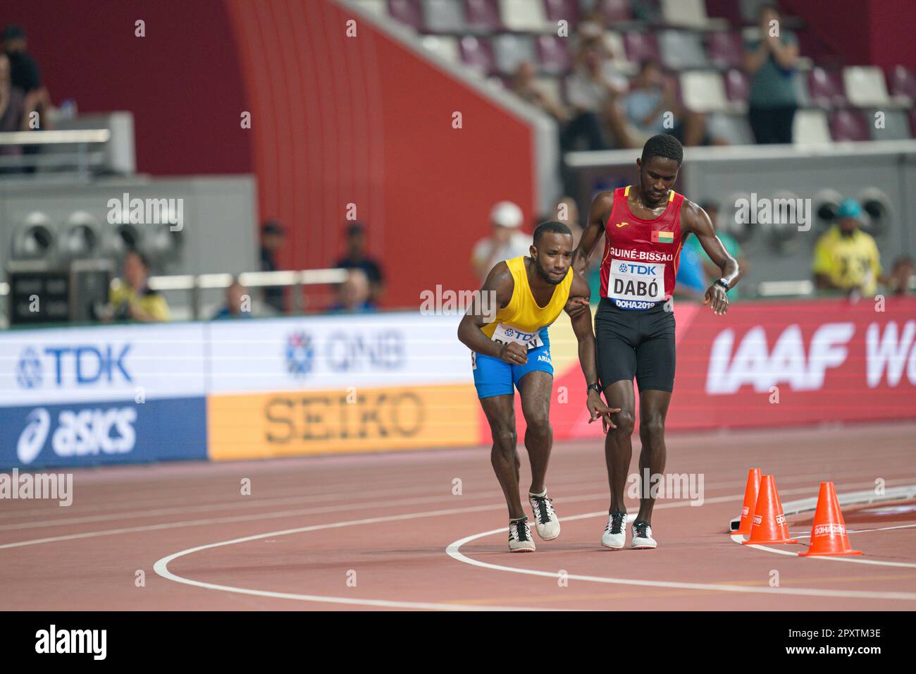 Braima SUNCAR DABO r. (Guinea-Bissau) helps Jonathan BUSBY (Aruba ...