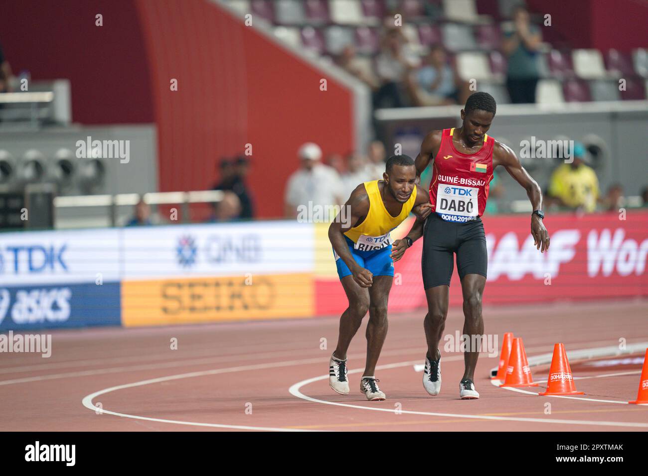 Braima SUNCAR DABO r. (Guinea-Bissau) helps Jonathan BUSBY (Aruba ...