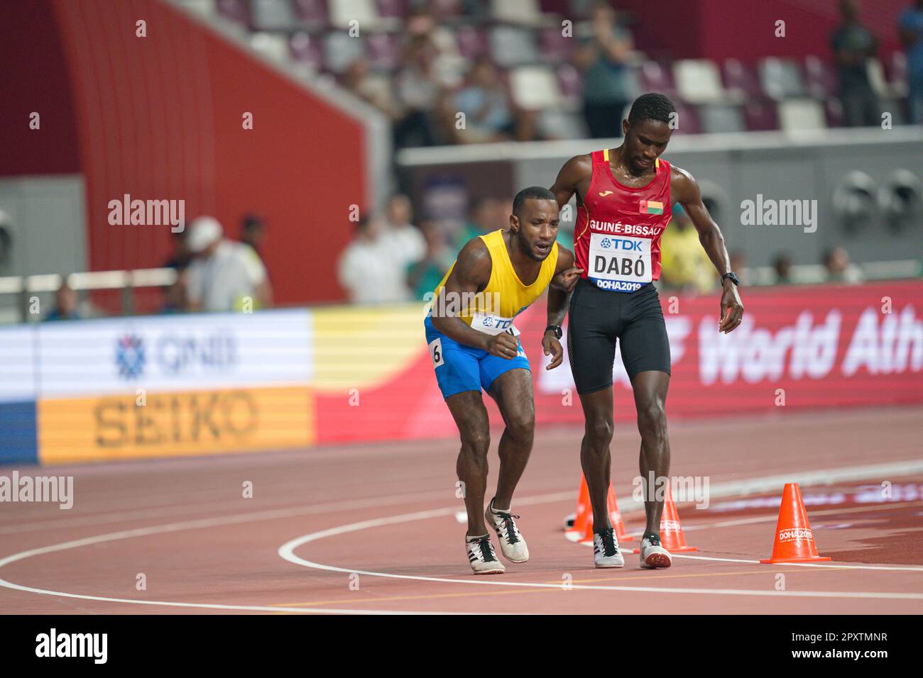 Braima SUNCAR DABO r. (Guinea-Bissau) helps Jonathan BUSBY (Aruba ...