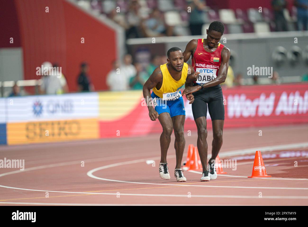 Braima SUNCAR DABO r. (Guinea-Bissau) helps Jonathan BUSBY (Aruba ...