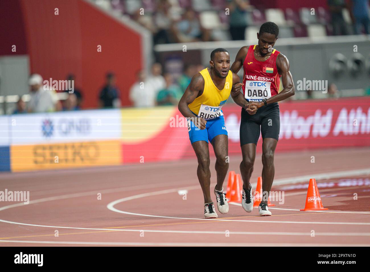 Braima SUNCAR DABO r. (Guinea-Bissau) helps Jonathan BUSBY (Aruba ...