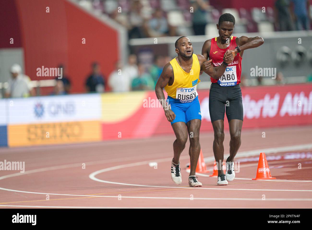 Braima SUNCAR DABO r. (Guinea-Bissau) helps Jonathan BUSBY (Aruba ...