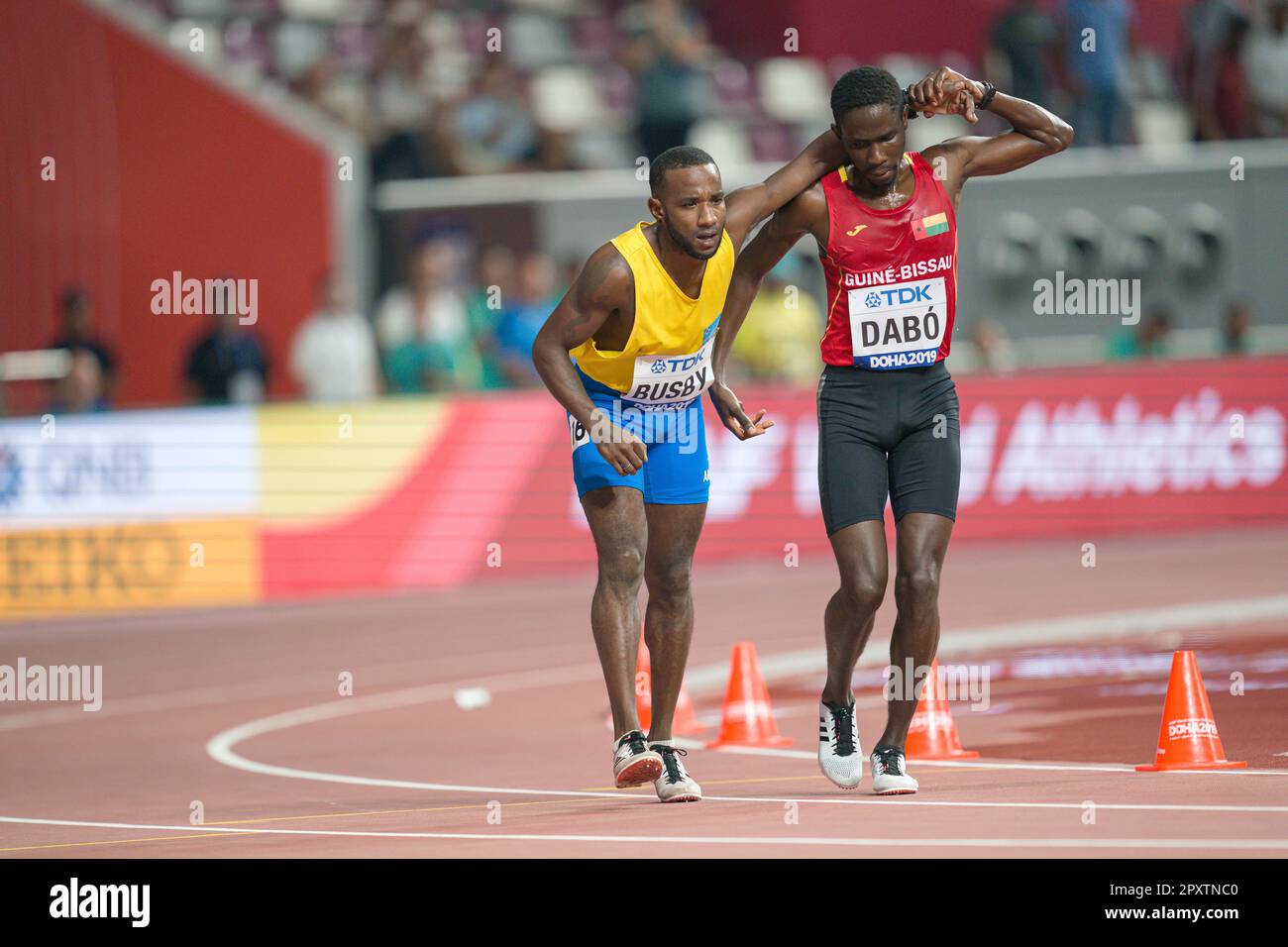 Braima SUNCAR DABO r. (Guinea-Bissau) helps Jonathan BUSBY (Aruba ...