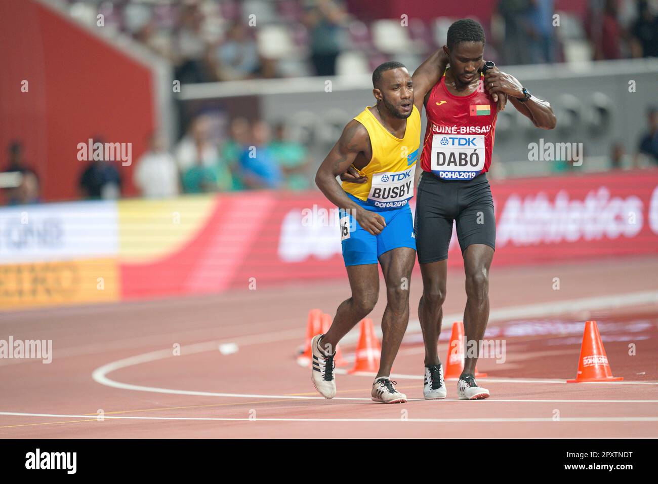 Braima SUNCAR DABO r. (Guinea-Bissau) helps Jonathan BUSBY (Aruba ...