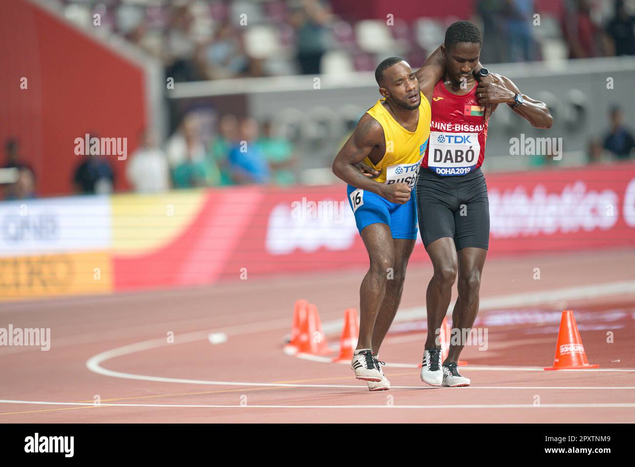 Braima SUNCAR DABO r. (Guinea-Bissau) helps Jonathan BUSBY (Aruba ...