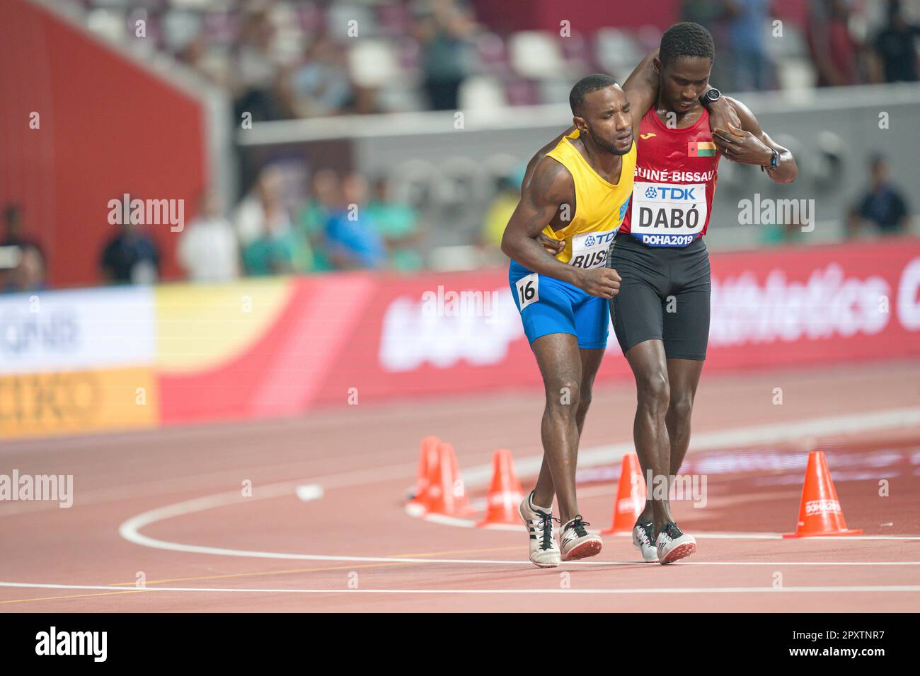 Braima SUNCAR DABO r. (Guinea-Bissau) helps Jonathan BUSBY (Aruba ...