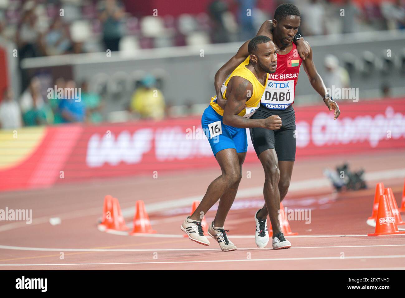 Braima SUNCAR DABO r. (Guinea-Bissau) helps Jonathan BUSBY (Aruba ...