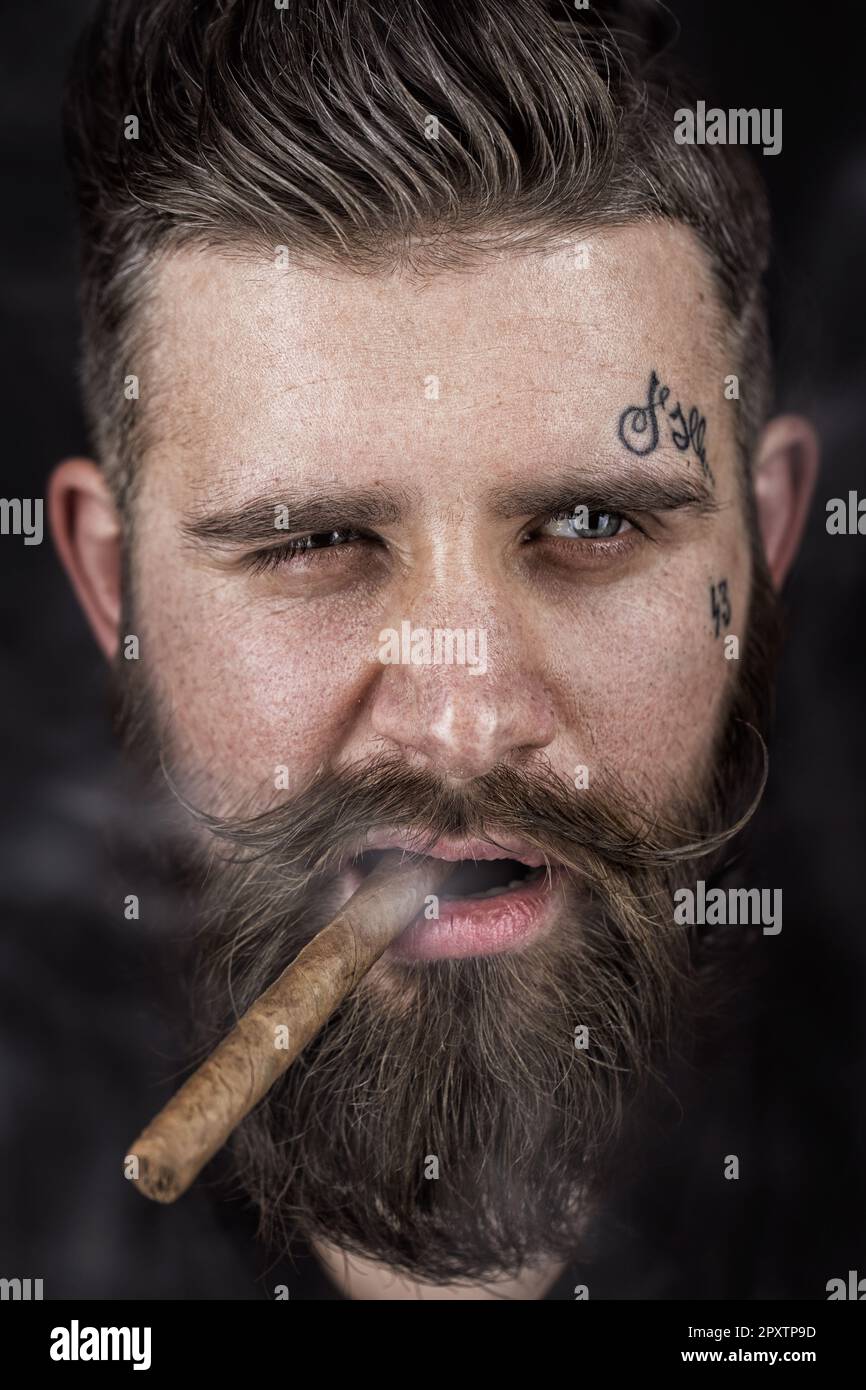A solid man with a beard and mustache. Photos shot in the studio Stock ...