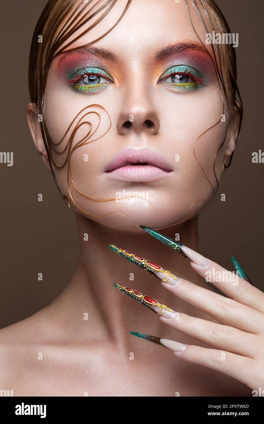 Beautiful girl with bright fashion make-up, creative hairstyle, long ...