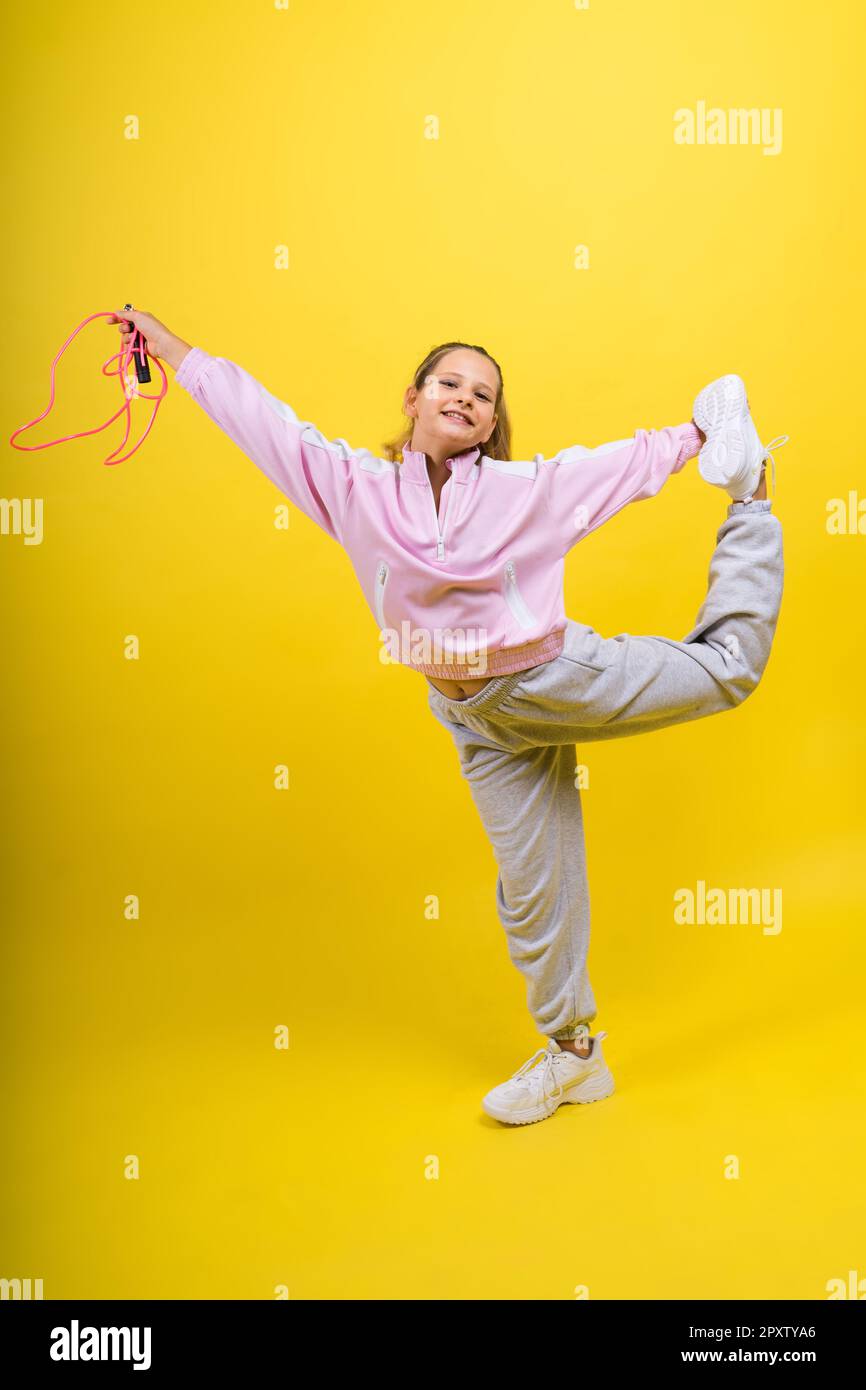 Adorable female child with skipping rope jumping in a studio Stock ...
