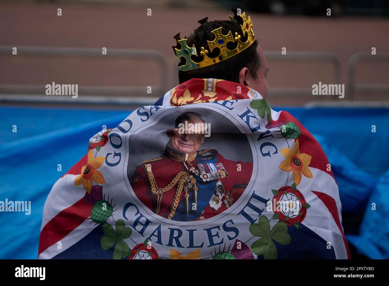 Royal enthusiast Patrick O'Neil sits along the King's Coronation route ...